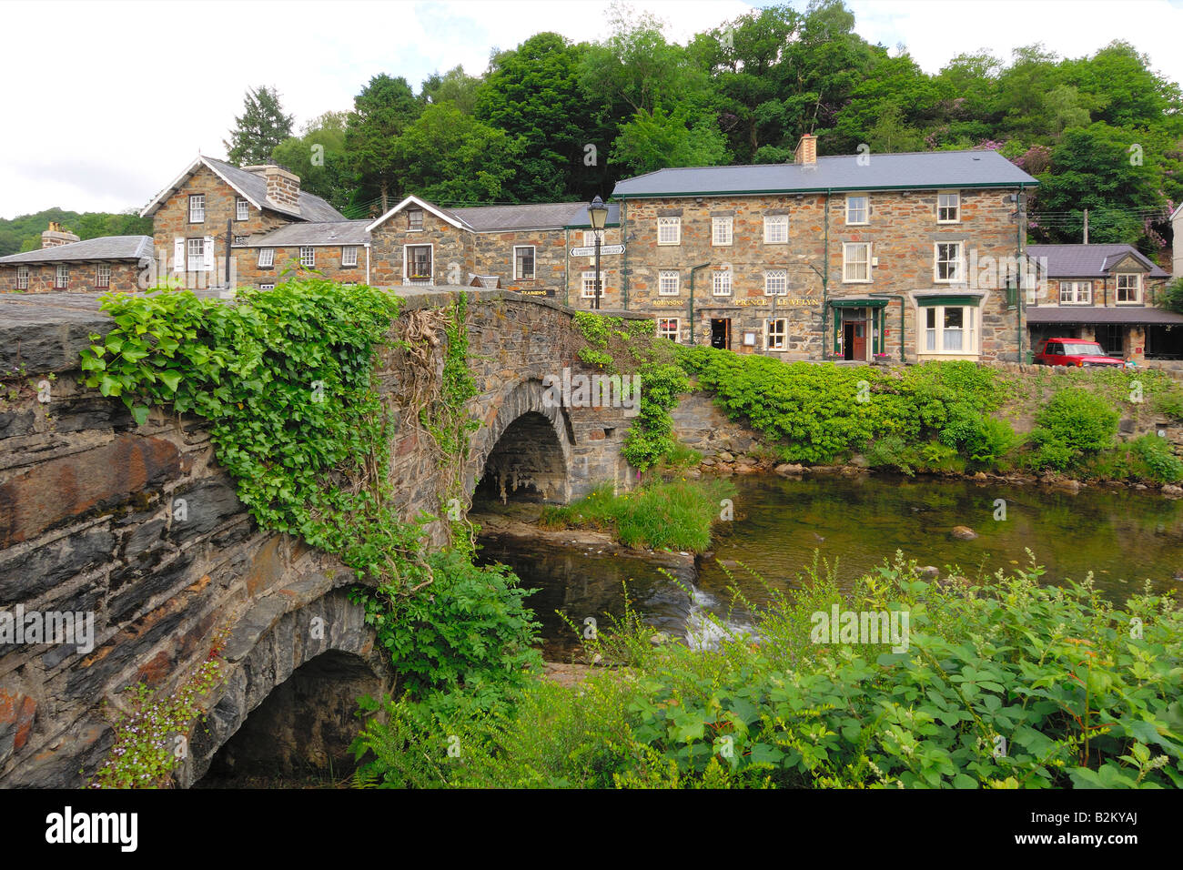The ivy covered bridge carrying the A4085 over the River Glaslyn at ...