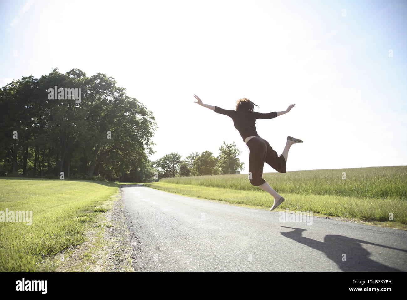 woman jumping in air Stock Photo - Alamy