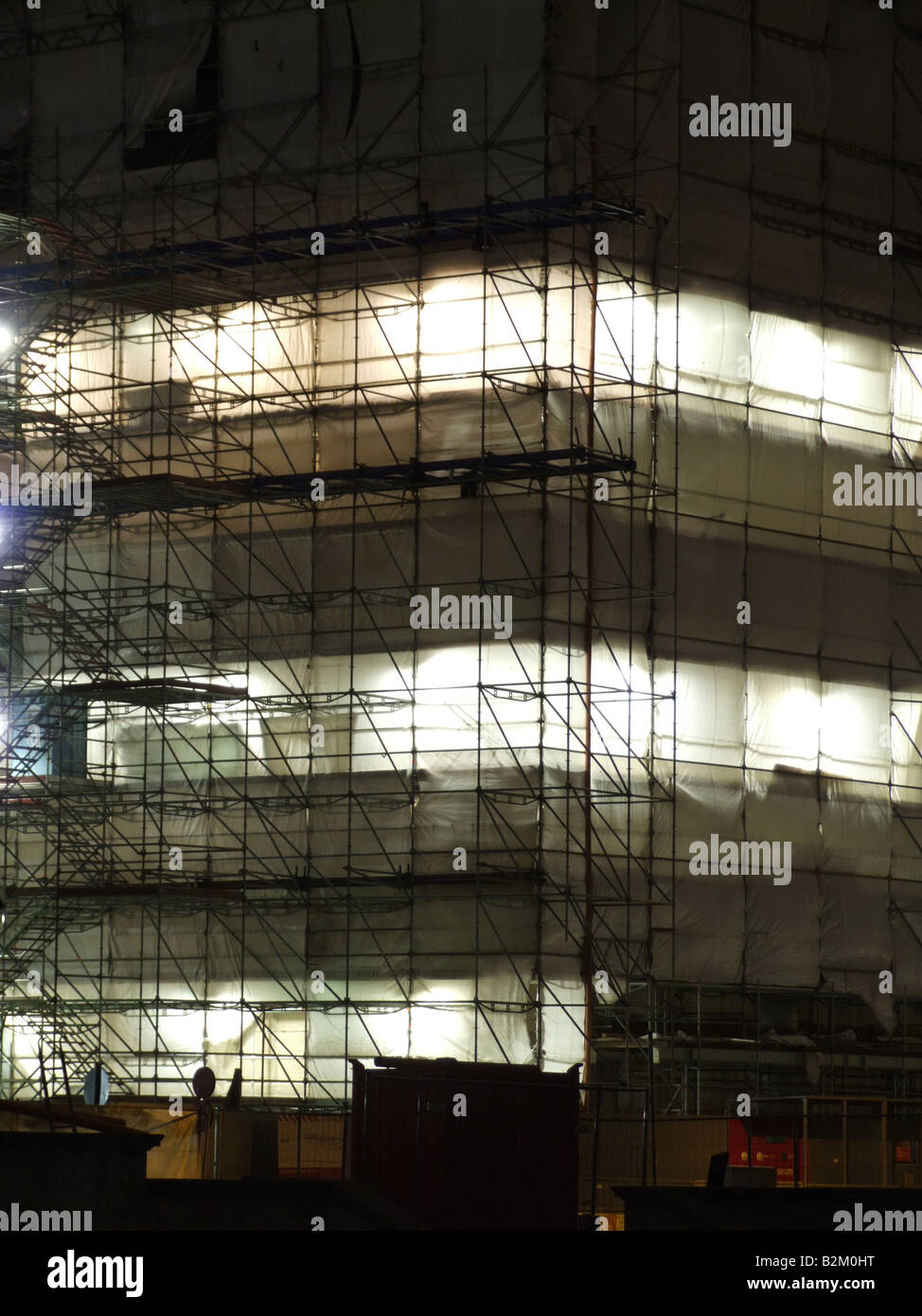building site scaffolding illuminated at night Stock Photo - Alamy