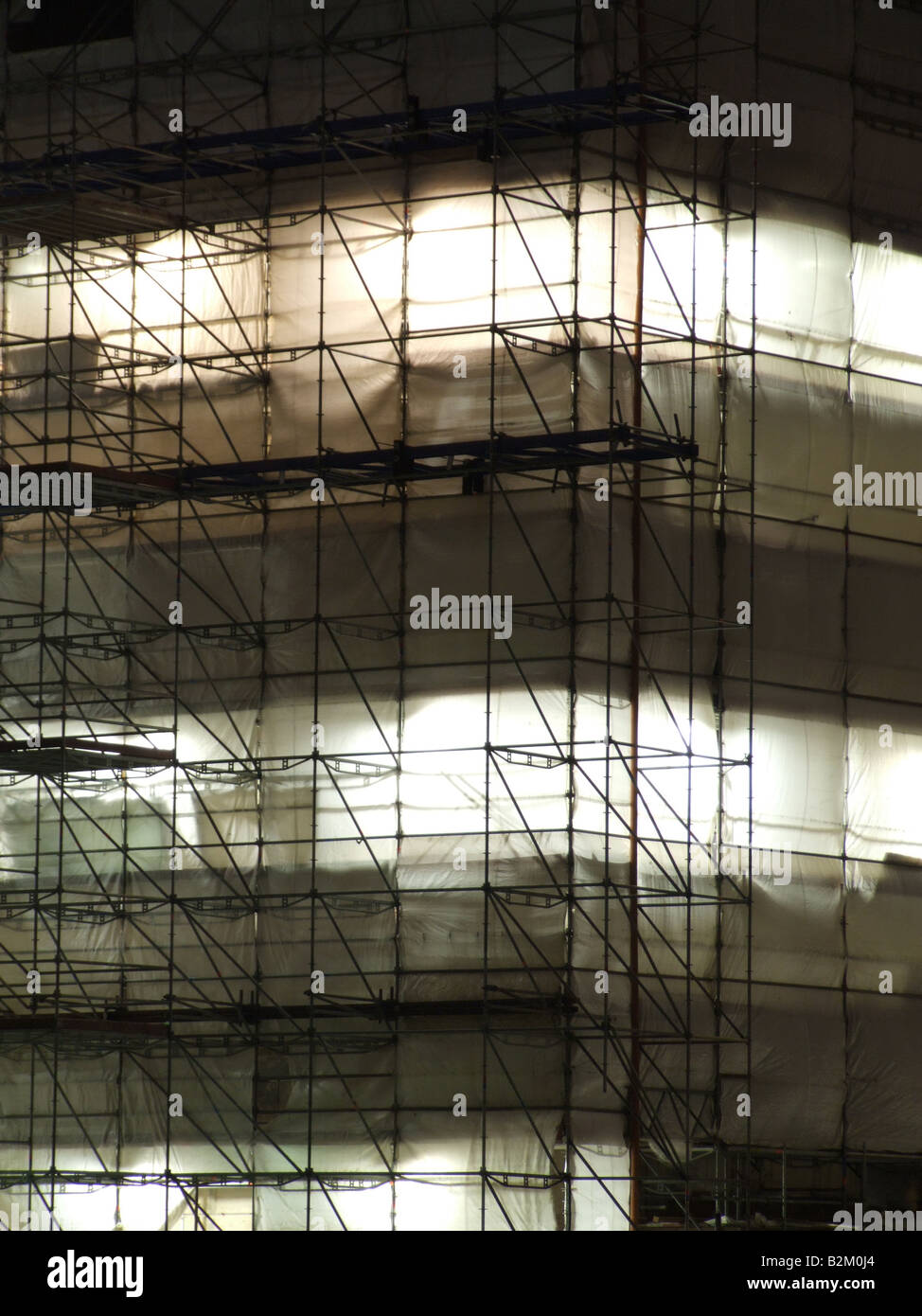 building site scaffolding illuminated at night Stock Photo - Alamy