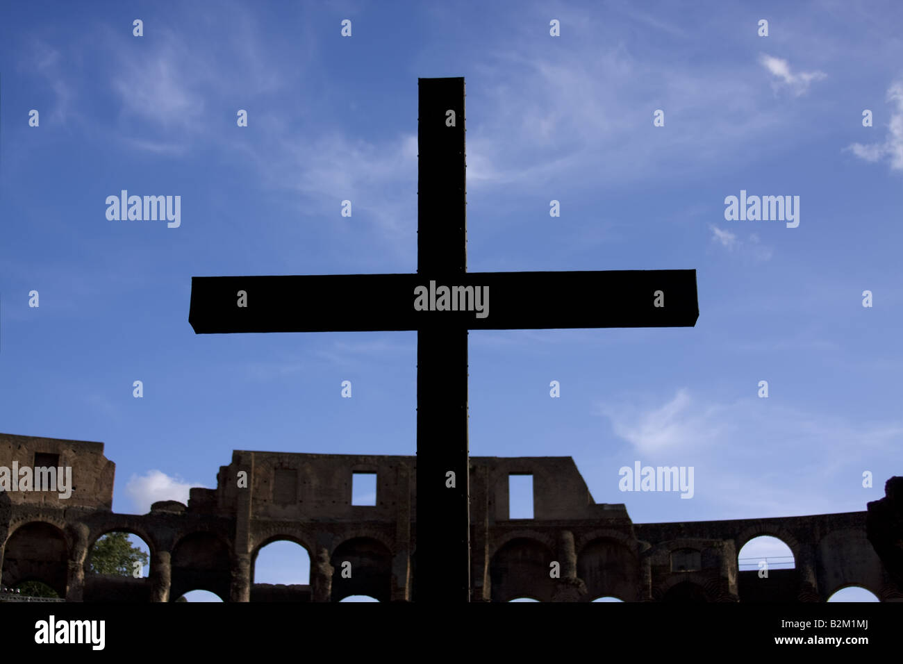 Silhouette of cross over blue sky in colosseum Stock Photo - Alamy