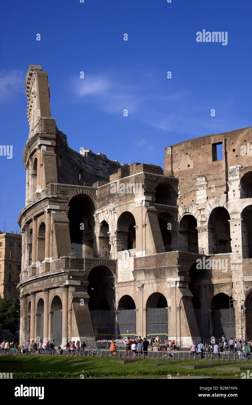 Colosseum in Rome with green grass and people Stock Photo - Alamy