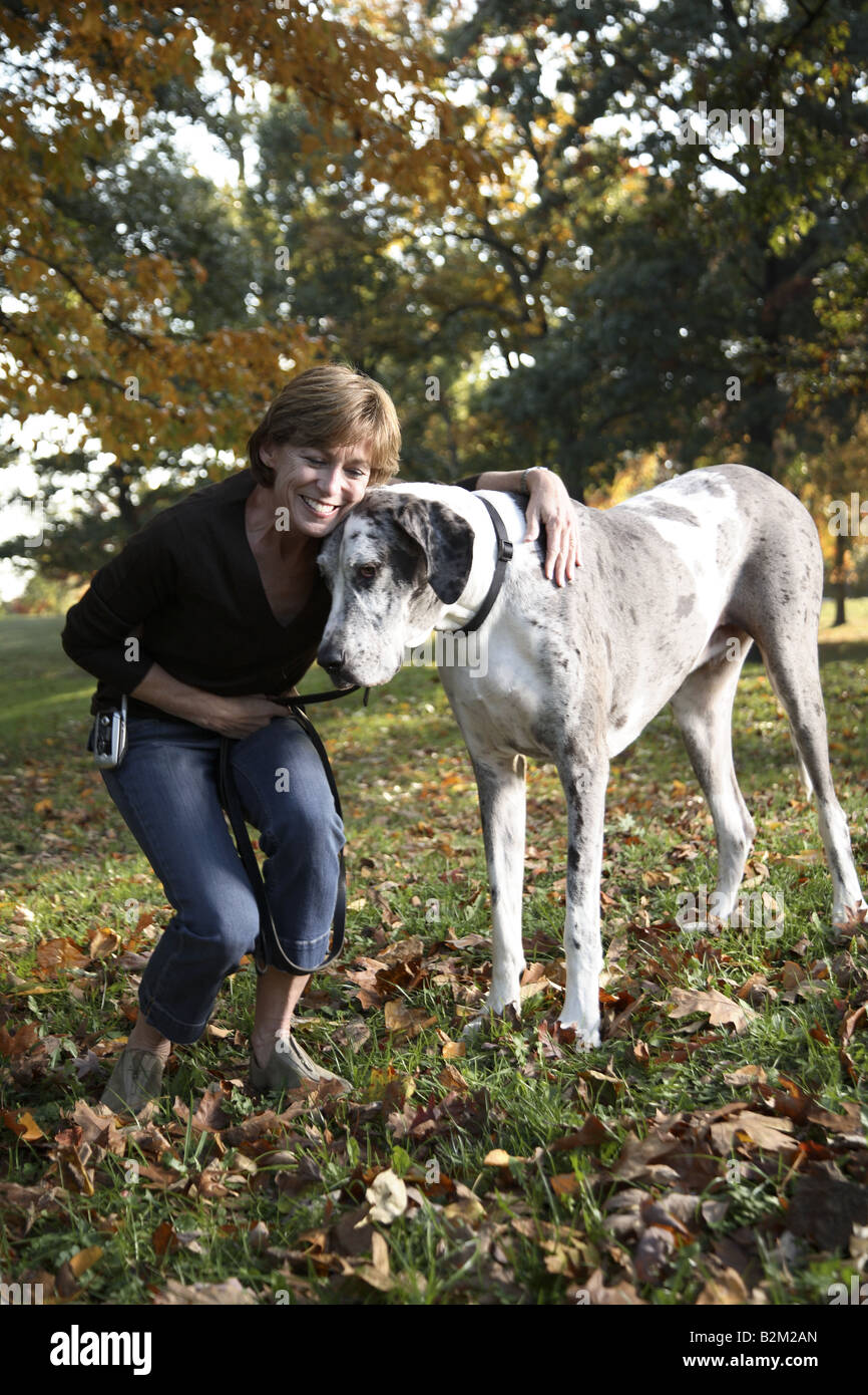 Mature woman with large dog Stock Photo - Alamy