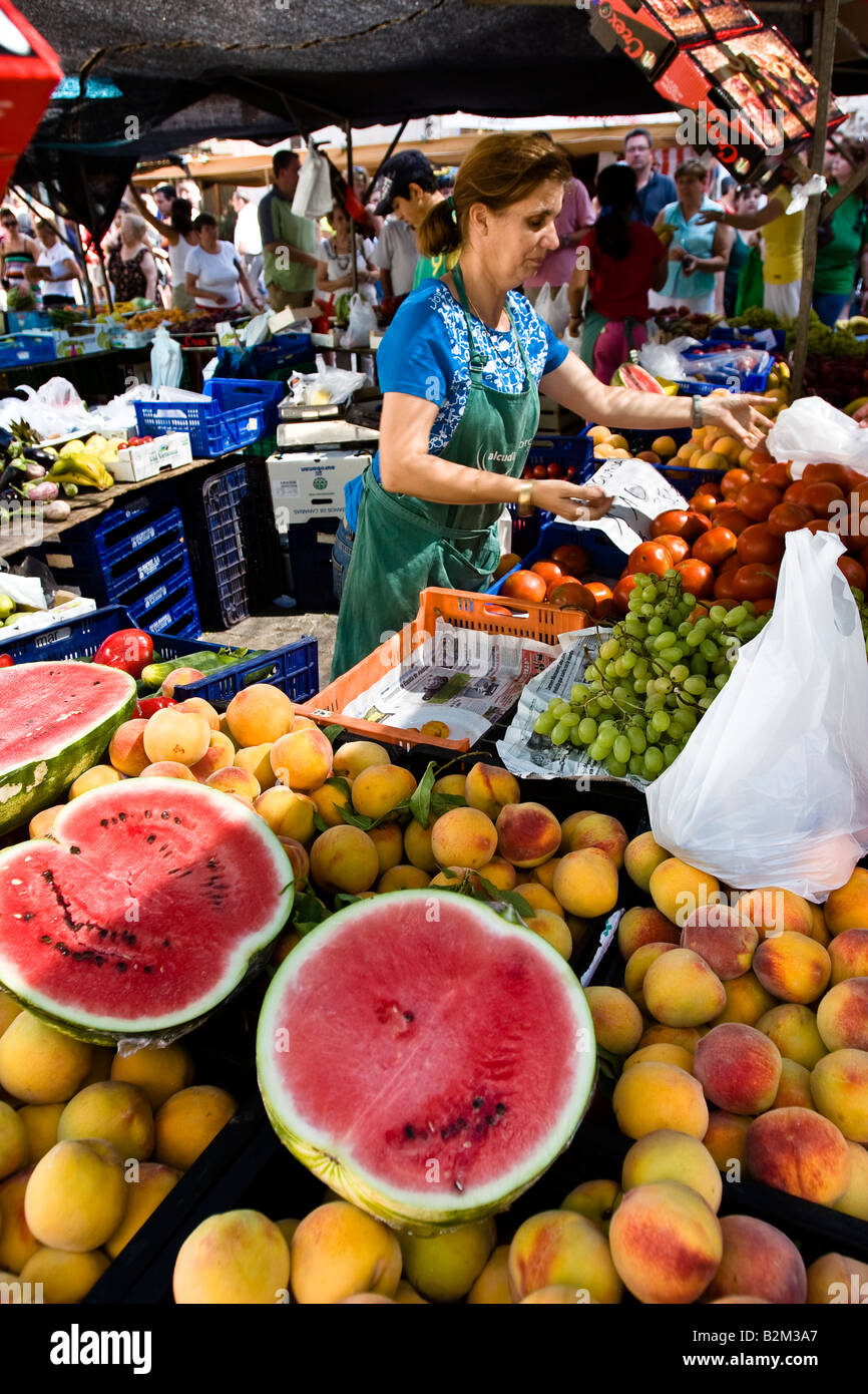 Woman sells fruits at the farmer's market in Sineu, Majorca, Balearic ...