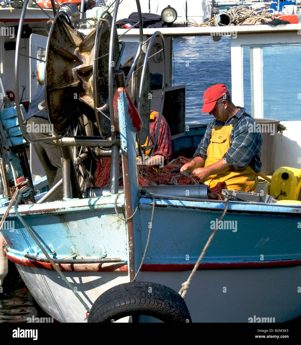 FR Marseille fisherman in his boat Stock Photo - Alamy