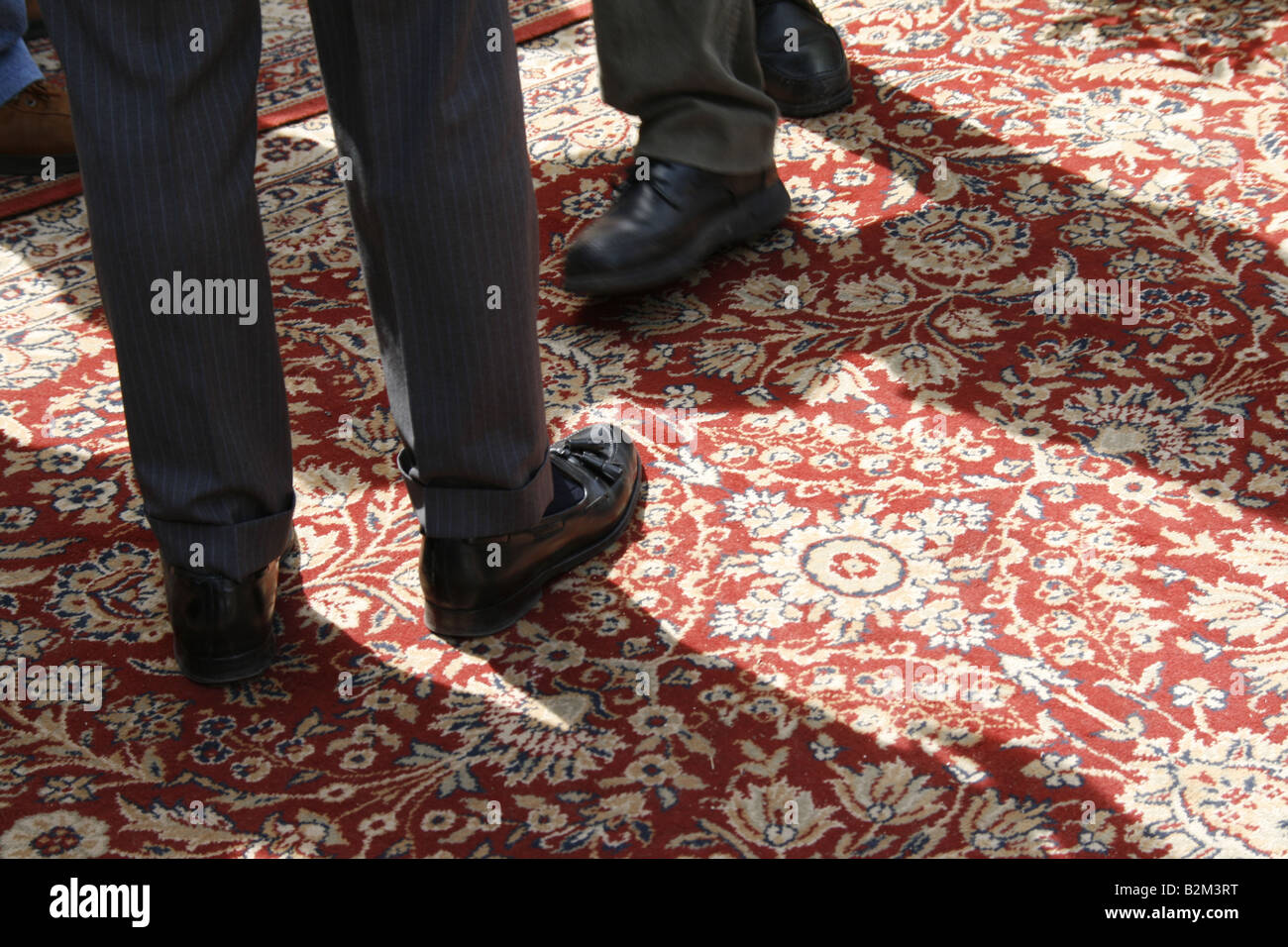 people standing on floral carpet outdoors in sun Stock Photo - Alamy