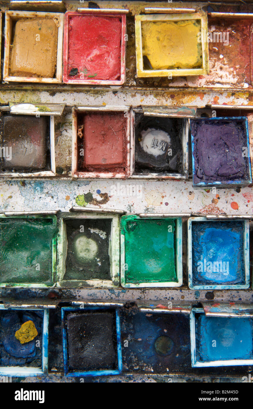Colorful watercolor paints arranged in a palette offering inspiration ...