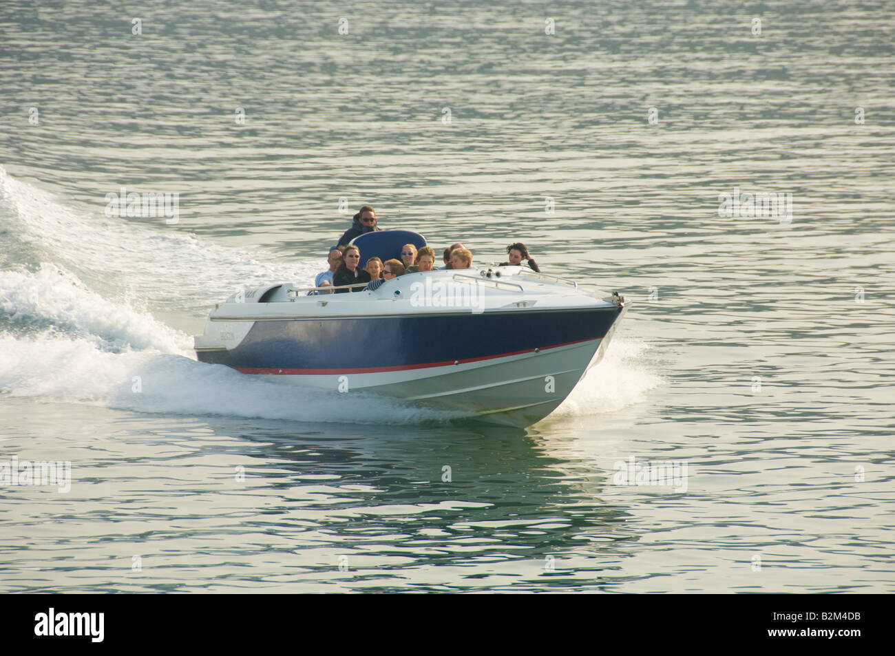 Speed boat travelling at speed with passengers on board. Scarborough ...