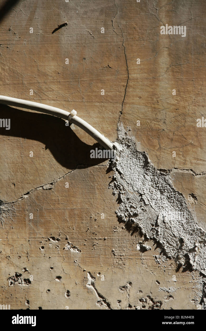 power supply cable with concrete filling on outside wall Stock Photo ...