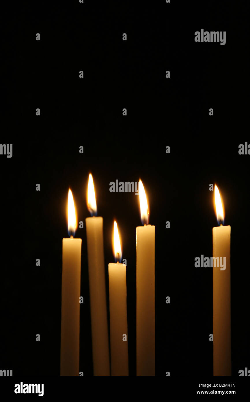 many lit candles in dark room in church Stock Photo - Alamy