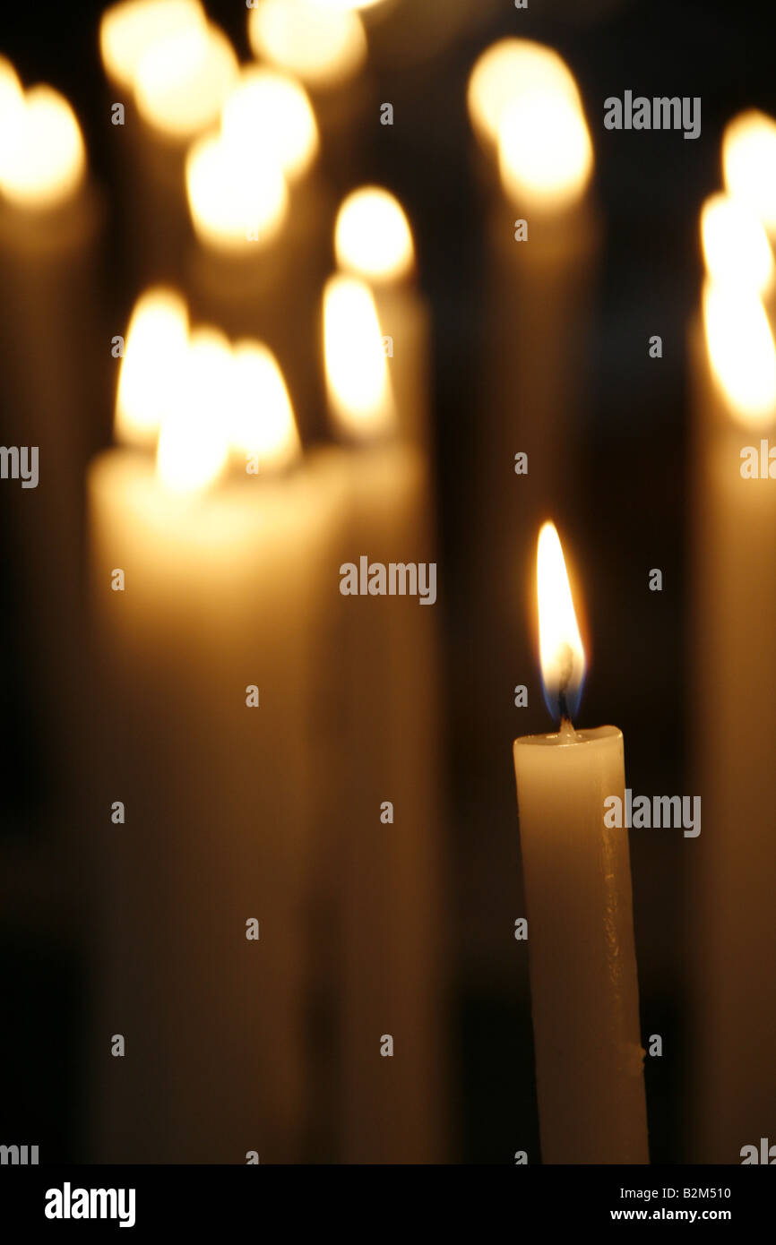 Lit candles in dark room hi-res stock photography and images - Alamy