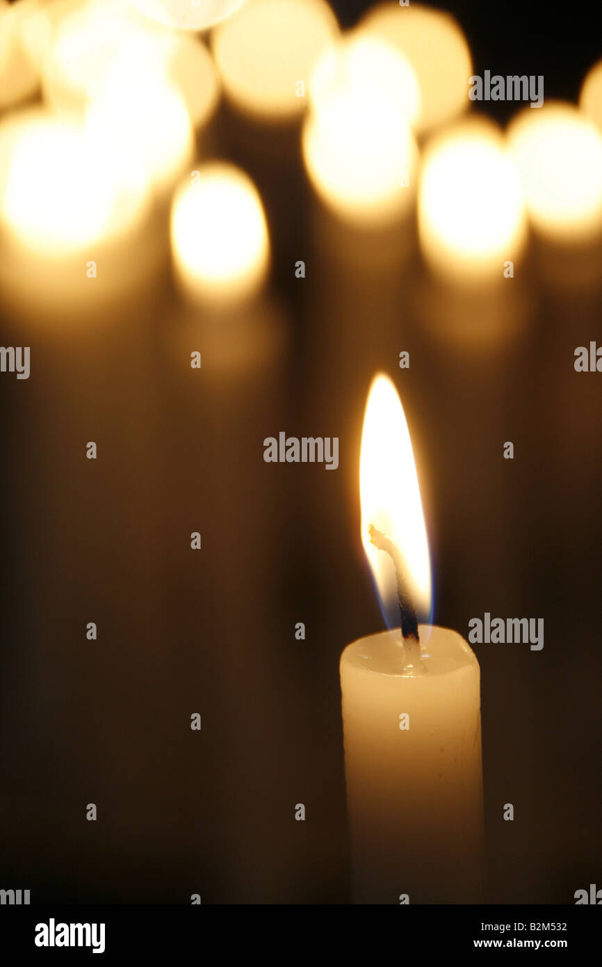 many lit candles in dark room in church Stock Photo - Alamy