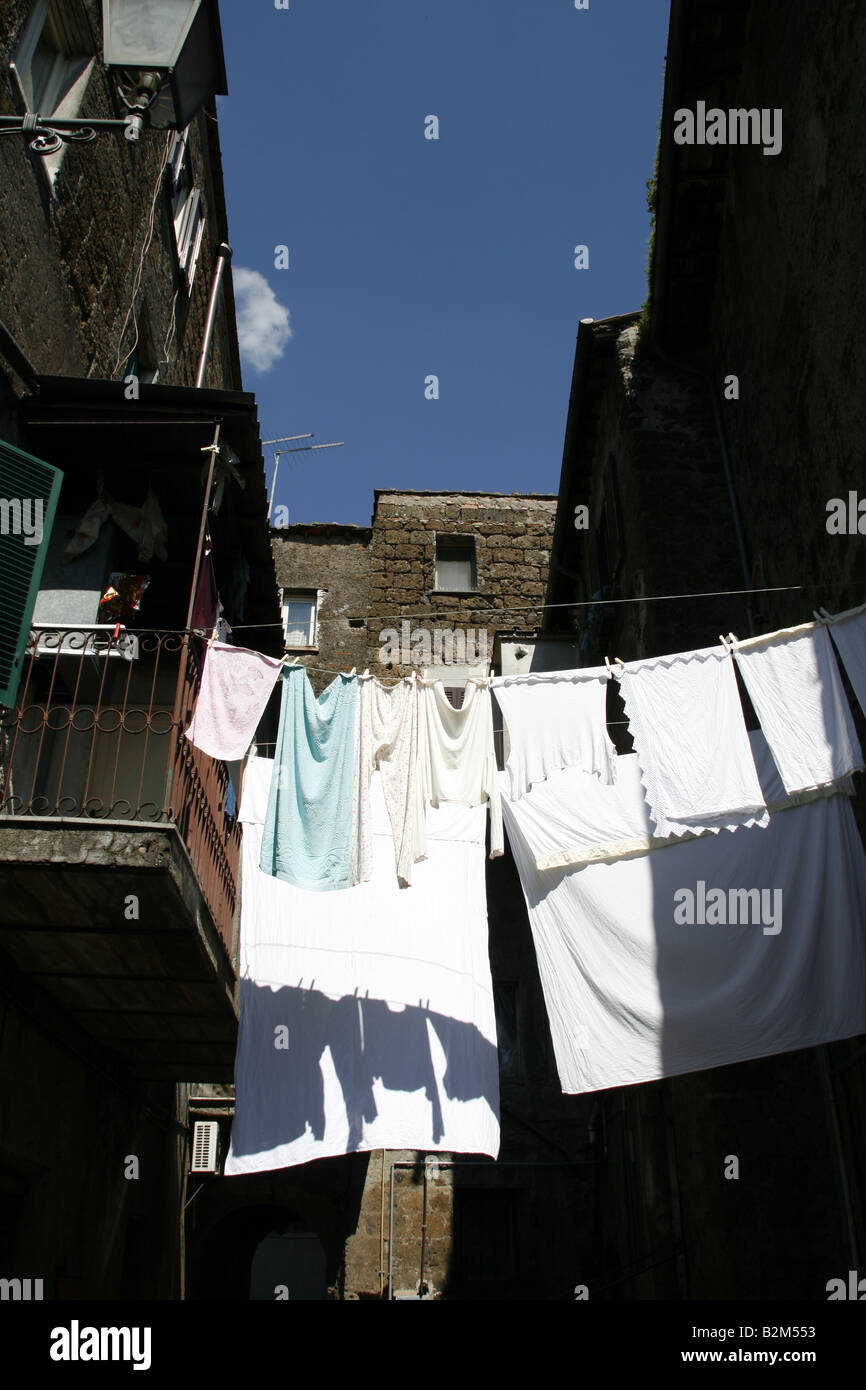 clothes on washing line outdoors in sun in italy Stock Photo - Alamy