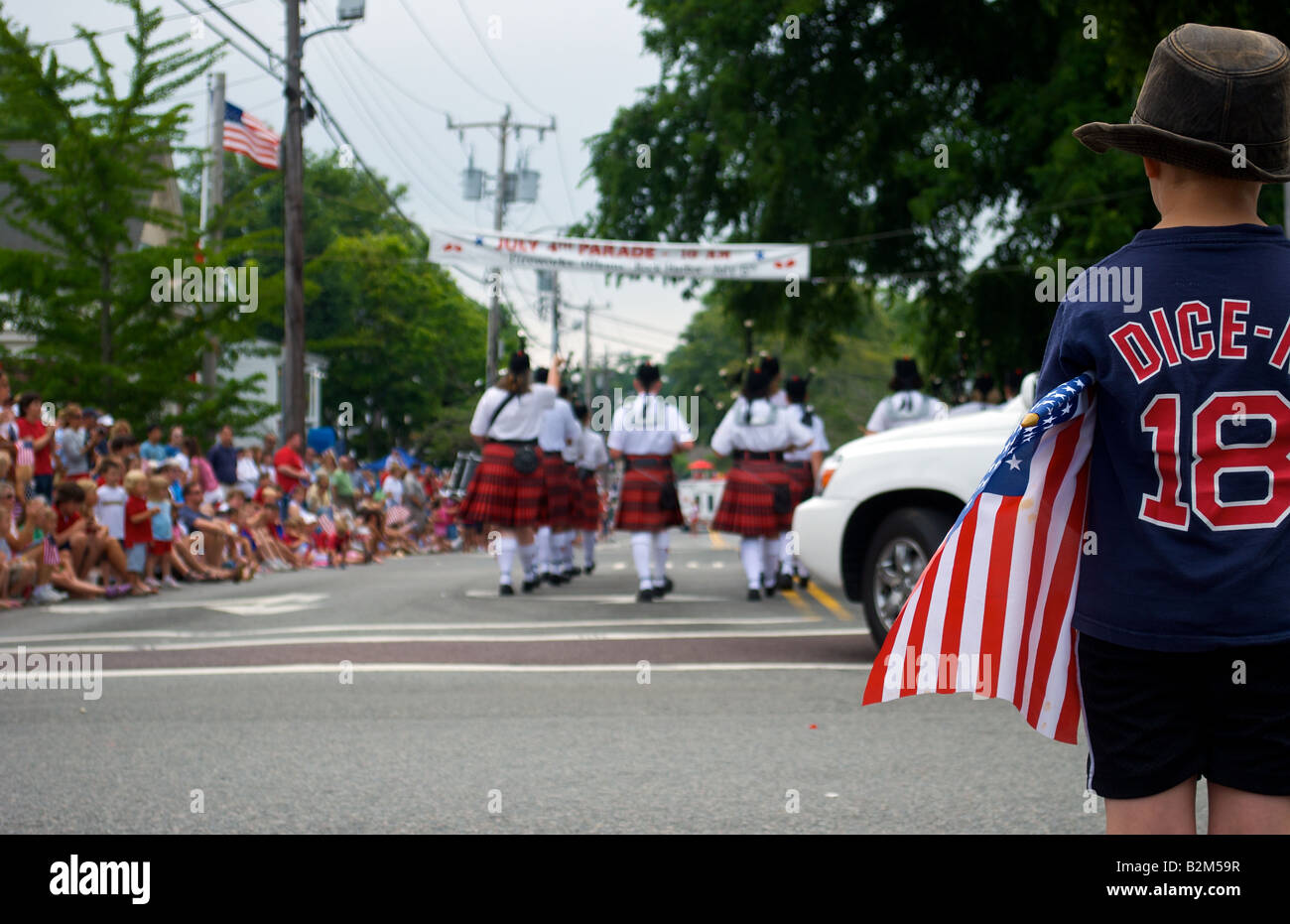 boy standing at the 4th of july parade Stock Photo - Alamy