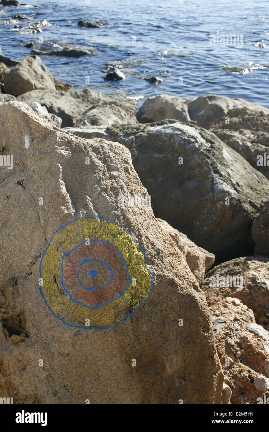 gun practice target painted on rocks by sea Stock Photo - Alamy