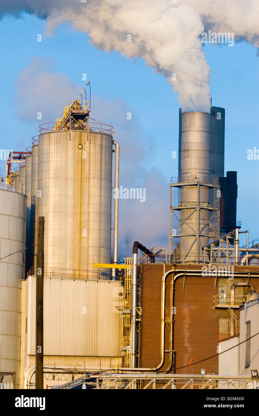 A factory emits smoke and steam on a cold winter day Stock Photo - Alamy