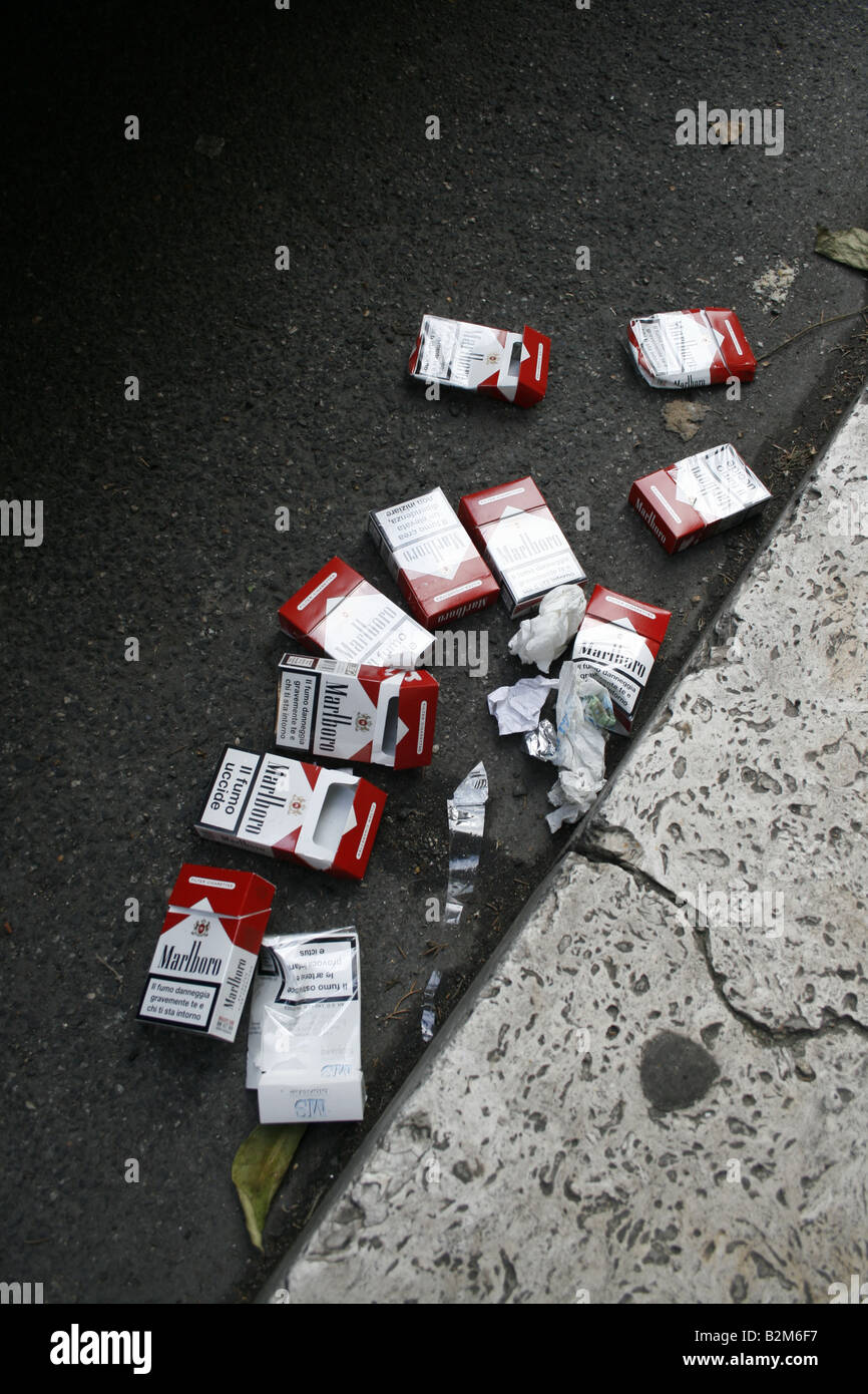 lots of cigarette packs left on street road Stock Photo - Alamy