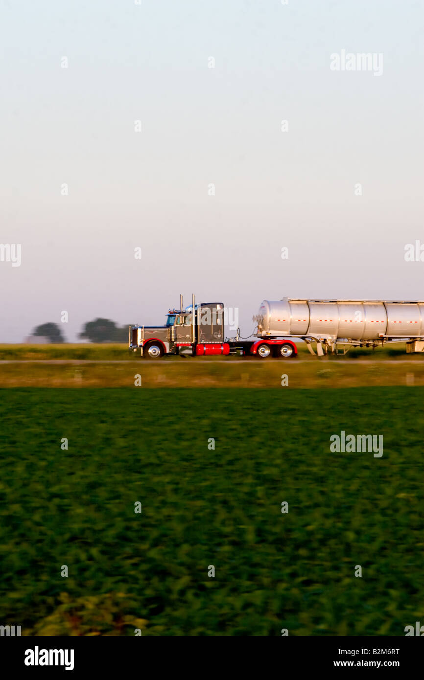 A tanker truck speeds down the intestate highway in rural Illinois ...