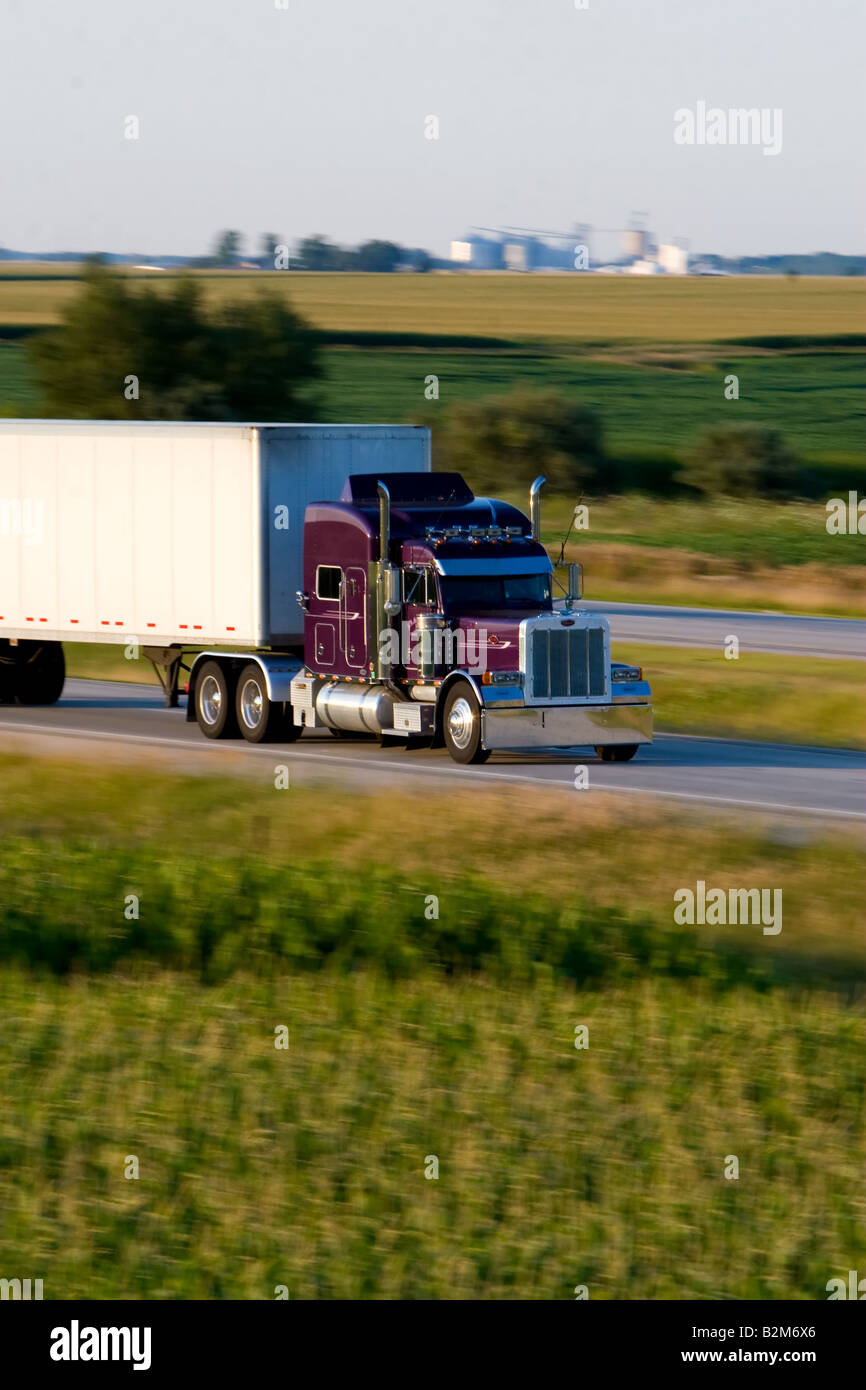 A semi tractor trailer truck speeds down the highway in rural Illinois ...
