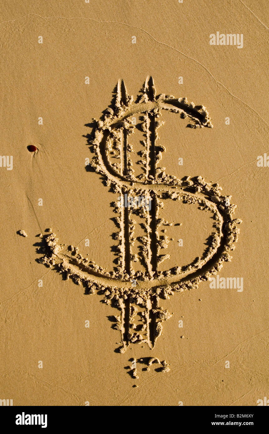 Dollar sign in the sand Stock Photo - Alamy