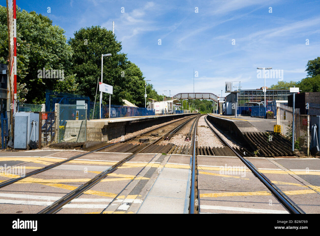 Train station and level crossing Liss Hampshire UK Stock Photo - Alamy