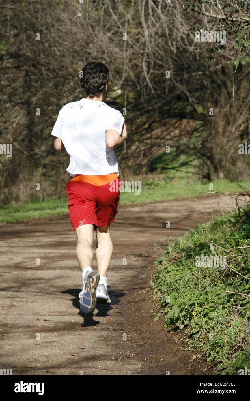 one man runner on rural country path in park Stock Photo - Alamy