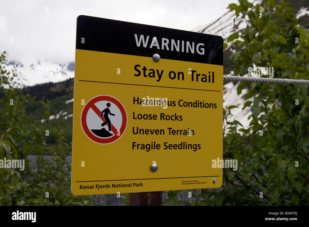 Warning sign Stay on Trail near exit glacier Stock Photo - Alamy