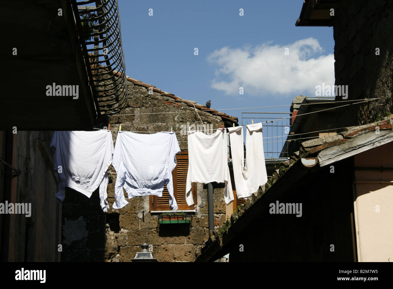 clothes on washing line outdoors in sun in italy Stock Photo - Alamy