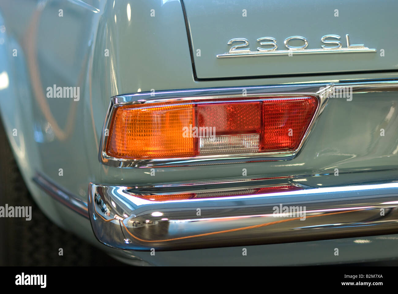 The rear light and model logo of a green Mercedes Benz 230 SL Stock ...