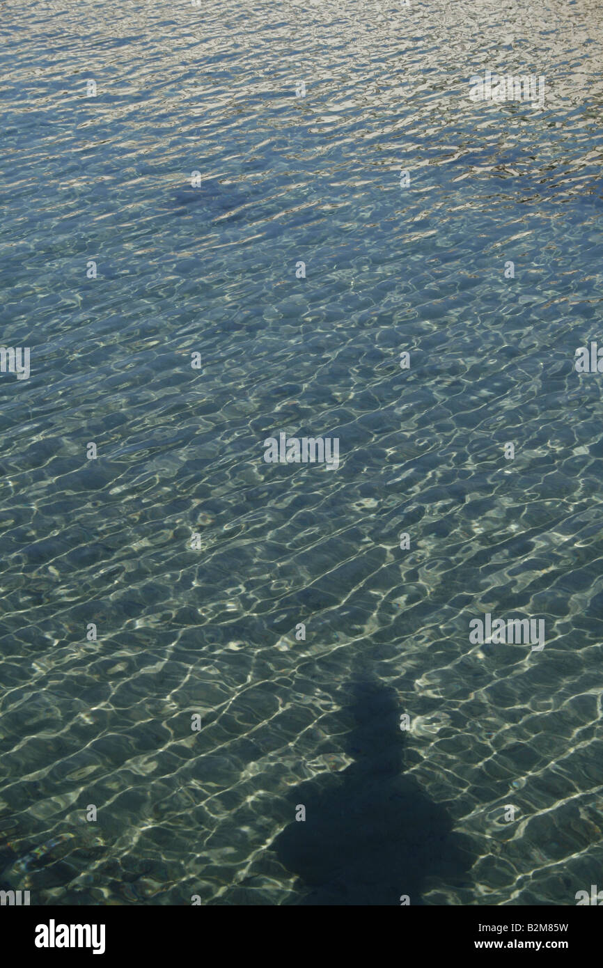one person's self portrait shadow in water in sea Stock Photo - Alamy