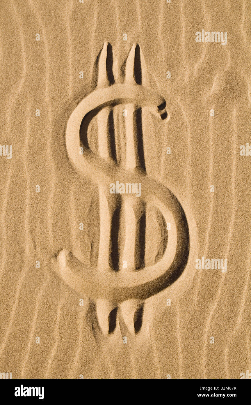 Dollar sign in the sand Stock Photo - Alamy