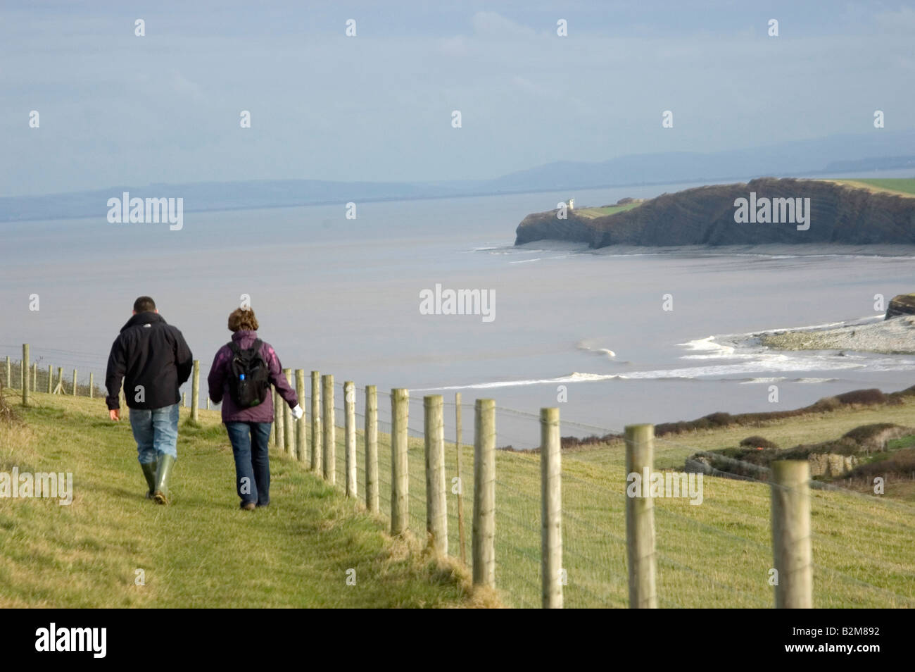 walkers on somerset coastal path Stock Photo - Alamy