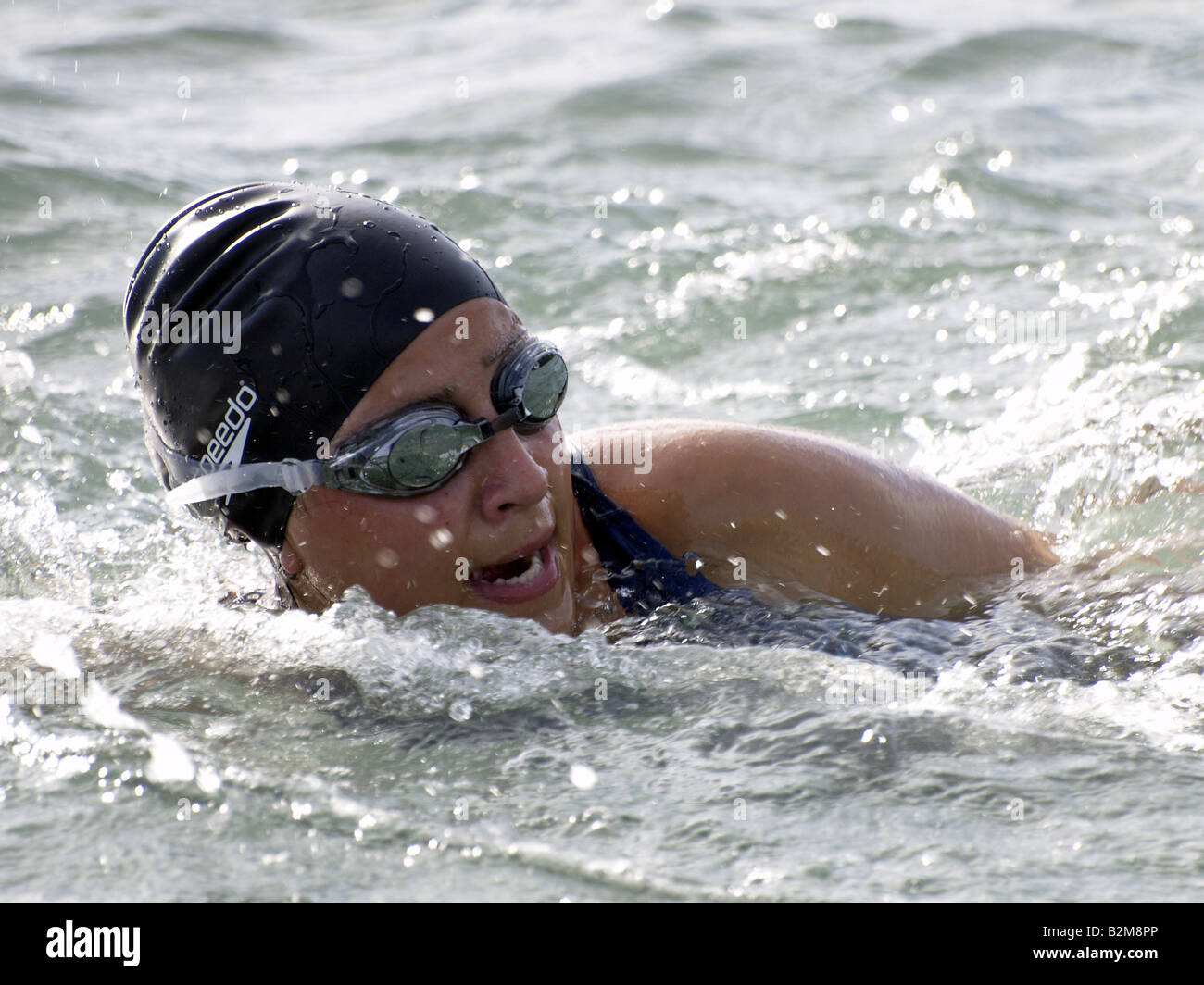 female swimmer wearing goggles and swimming cap Stock Photo - Alamy