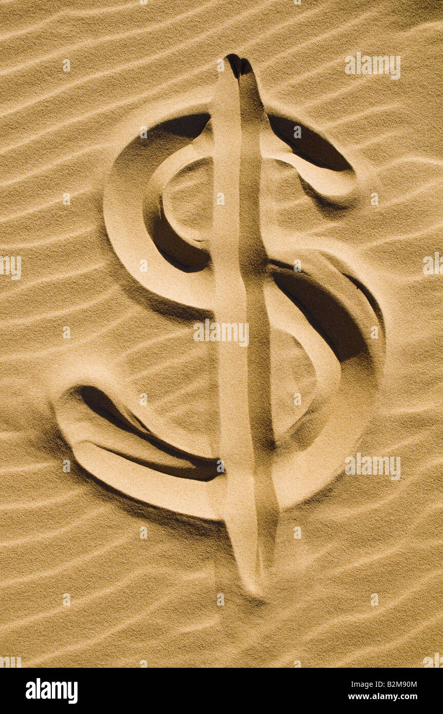 Dollar sign in the sand Stock Photo - Alamy