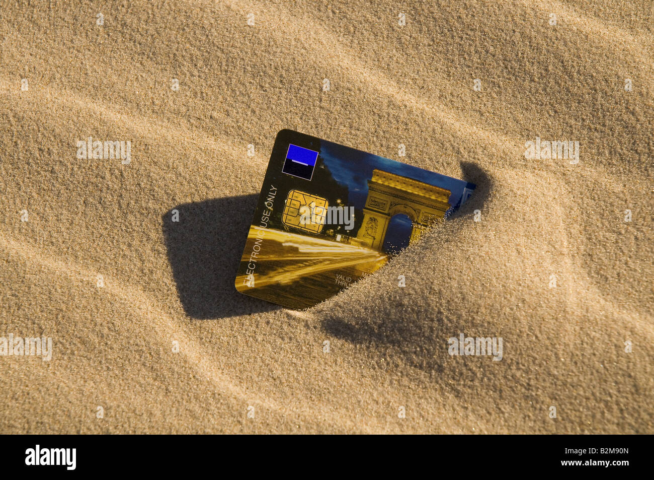 Credit card in the sand Stock Photo - Alamy