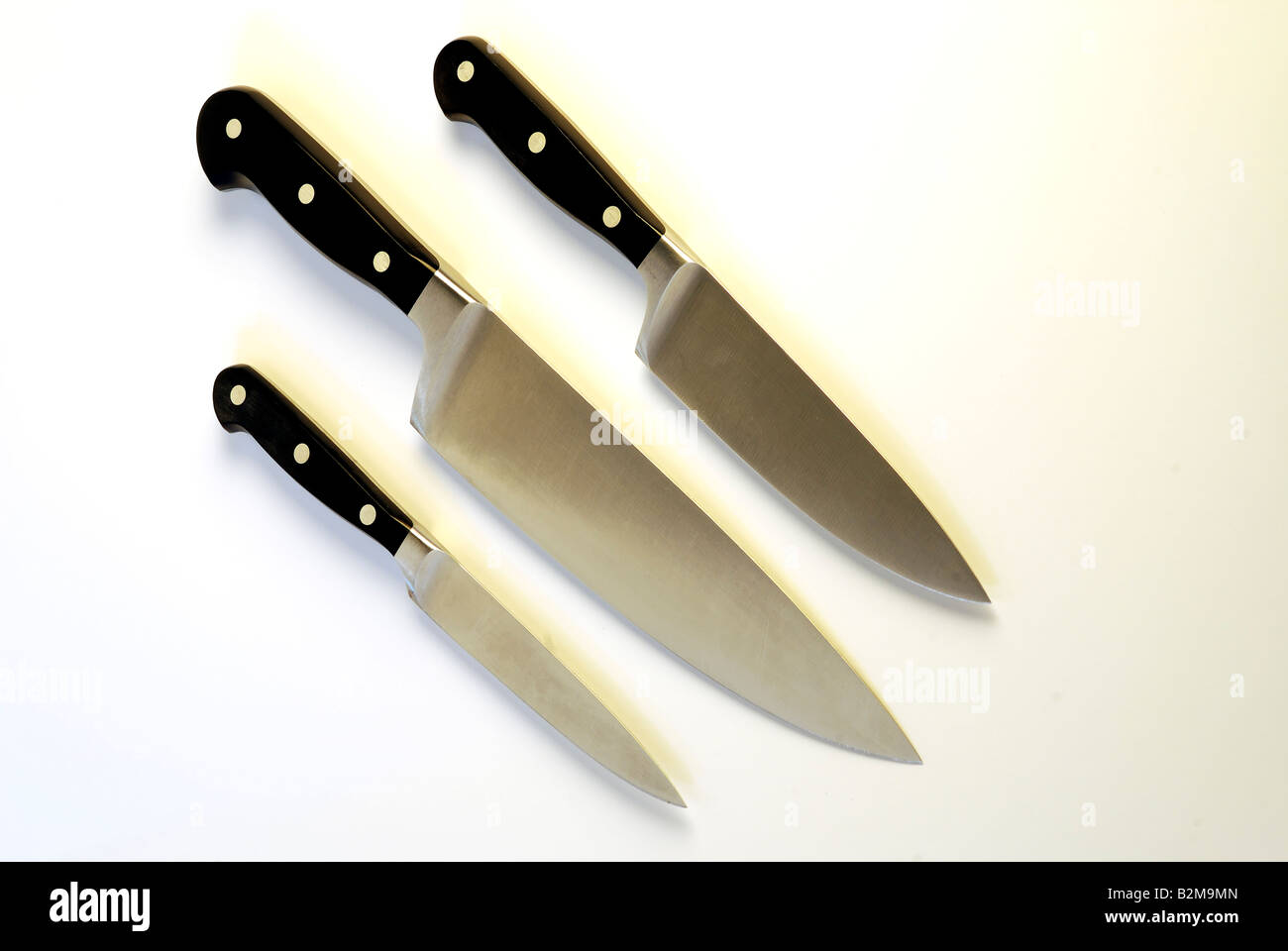set of three Kitchen Knives on white background Stock Photo - Alamy