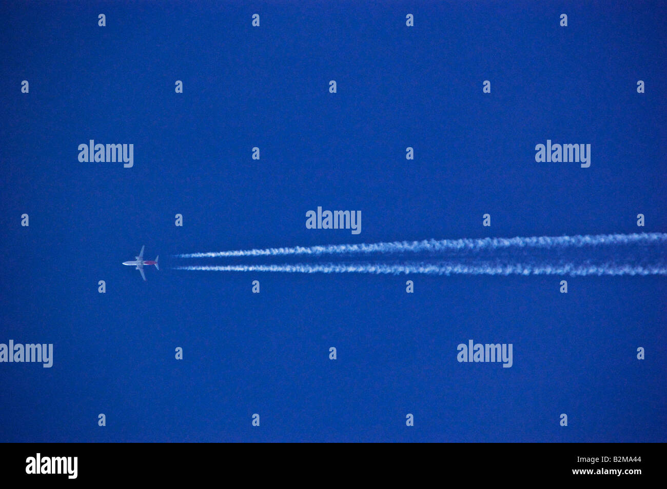 jet flying with smoke coming from the engines Stock Photo - Alamy