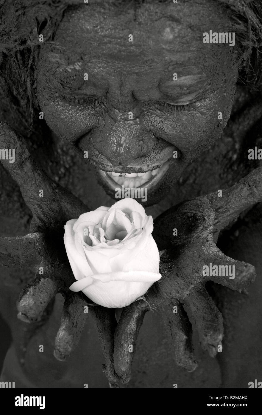 portrait of crying dirty girl holding rose Stock Photo - Alamy