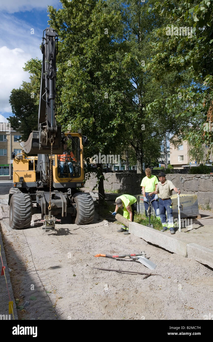 Working men paving street hi-res stock photography and images - Alamy