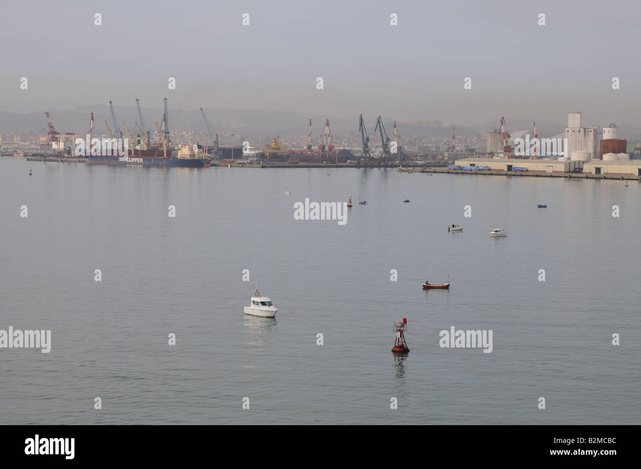 Santander port northern Spain harbour cranes derricks small boats ...