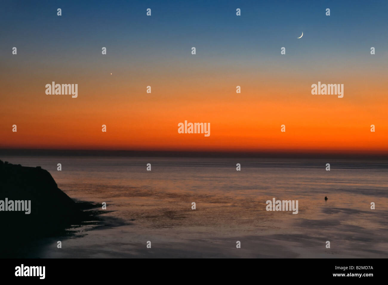 Sunset and crescent moon over ocean Los Angeles California USA Stock ...