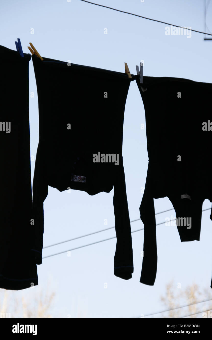 three clothing items on washing line outdoors Stock Photo - Alamy