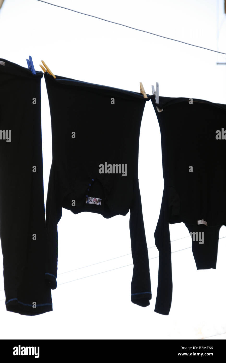 three clothing items on washing line outdoors Stock Photo - Alamy