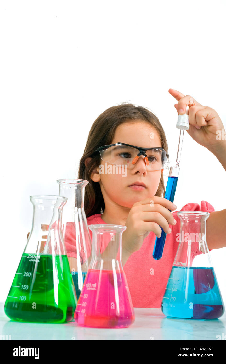 young girl examining a test tube in a science class Stock Photo - Alamy