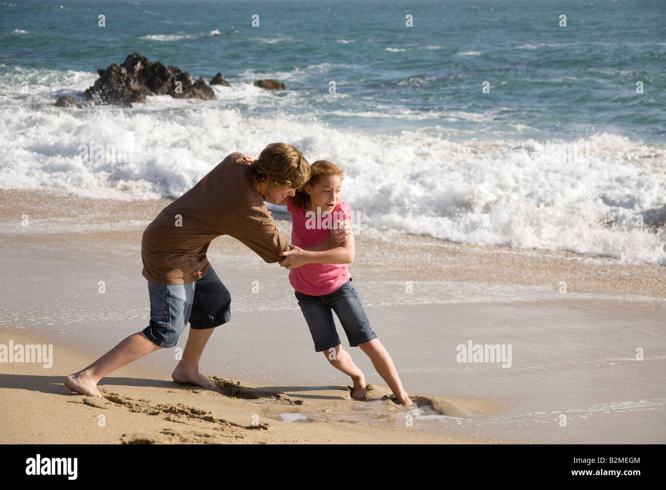 Brother sister fight beach hi-res stock photography and images - Alamy