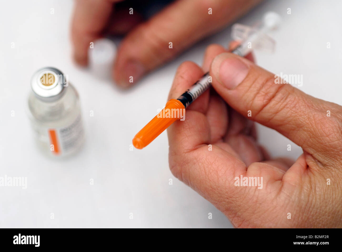 Diabetic preparing hypodermic syringe needle and insulin bottle Stock ...