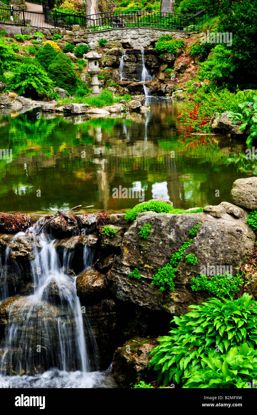 Cascading waterfall and pond in japanese garden Stock Photo - Alamy