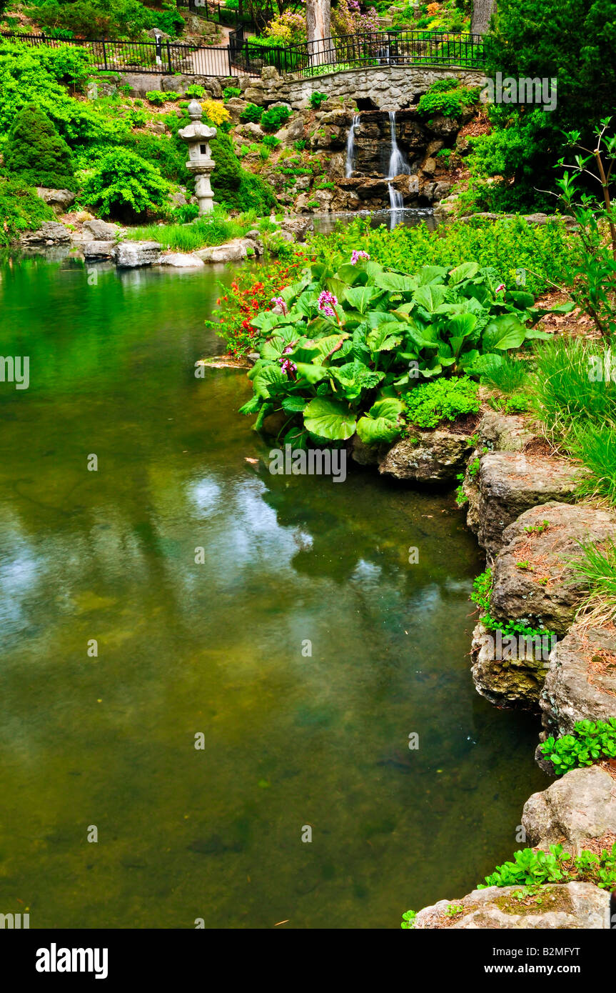 Cascading waterfall and pond in japanese garden Stock Photo - Alamy