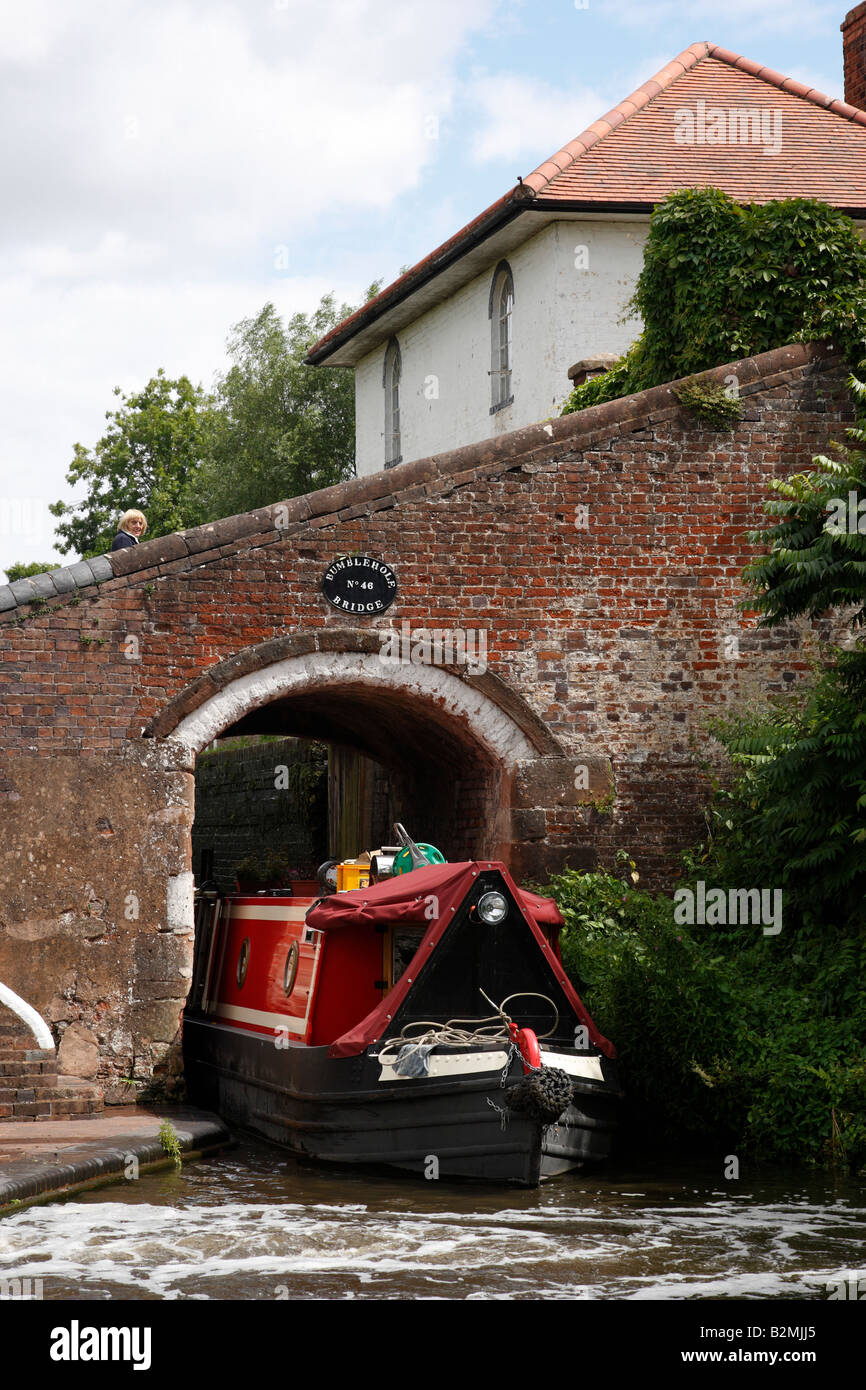 canal narrowboat exiting bridge number 46 bumble hole lock on the ...