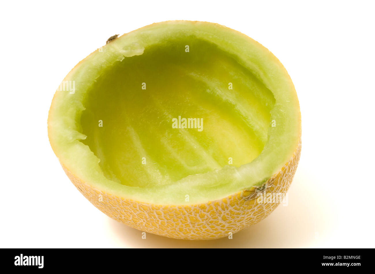Halved Galia melon eaten and scooped out Stock Photo - Alamy